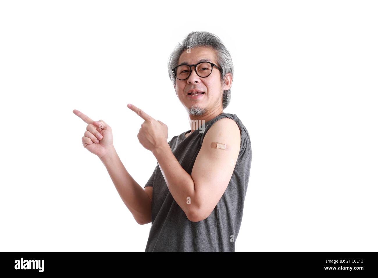 The senior Asian man showing plaster on his shoulder Stock Photo - Alamy