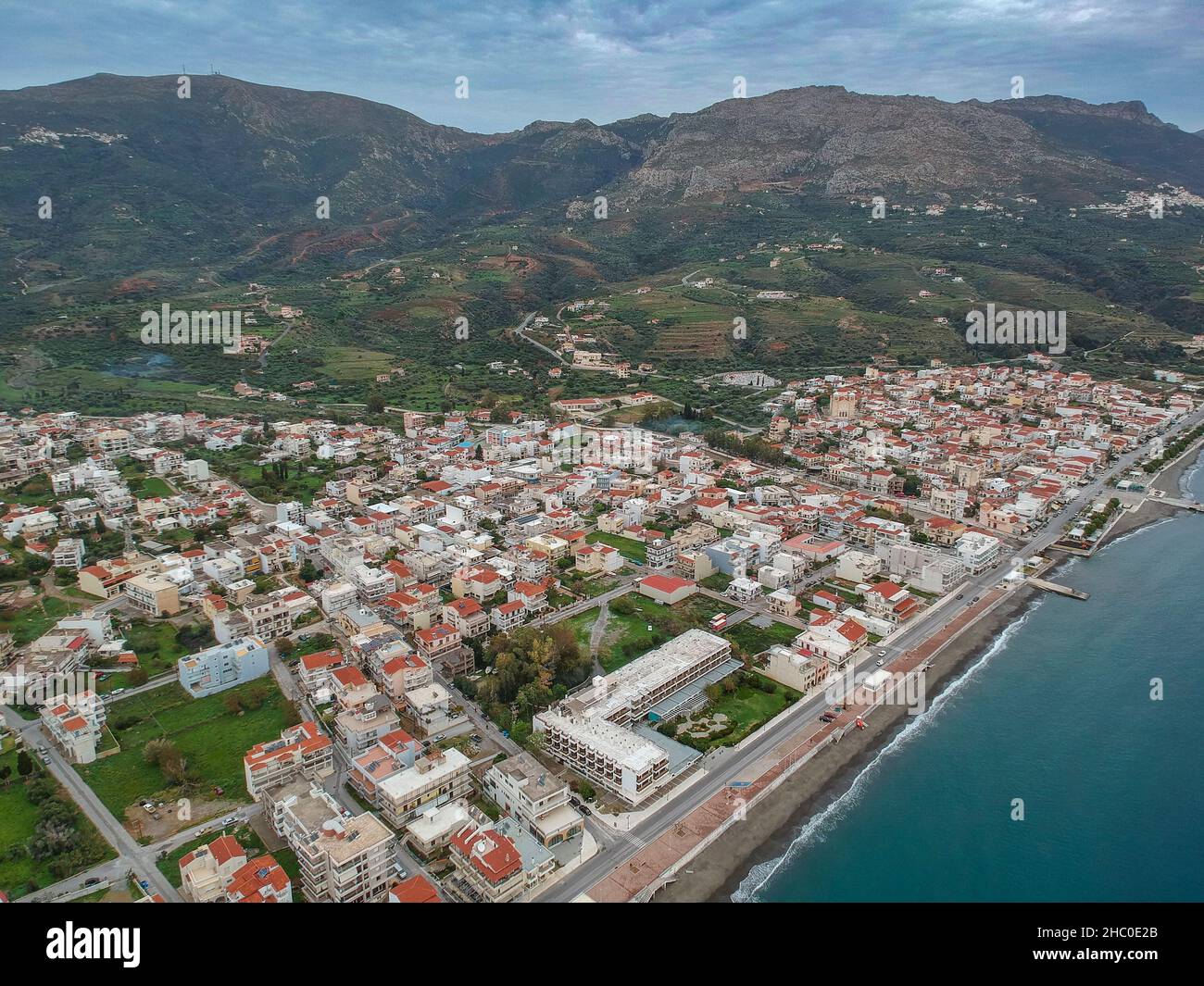 Aerial cityscape view of Neapolis town at sunset. Also named Vatika in ...
