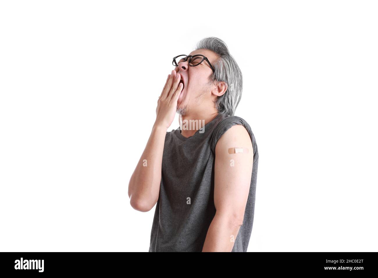 The senior Asian man showing plaster on his shoulder Stock Photo - Alamy