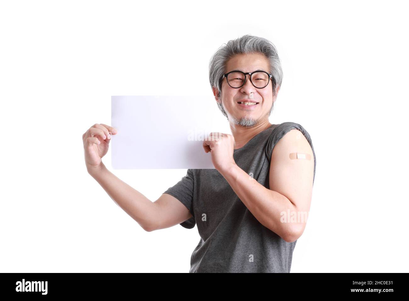 The senior Asian man showing plaster on his shoulder Stock Photo - Alamy