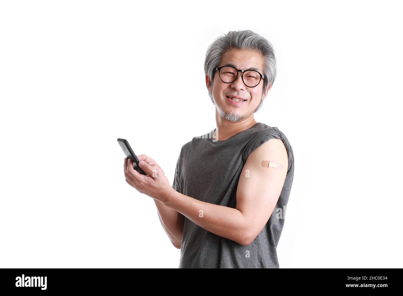The senior Asian man showing plaster on his shoulder Stock Photo - Alamy