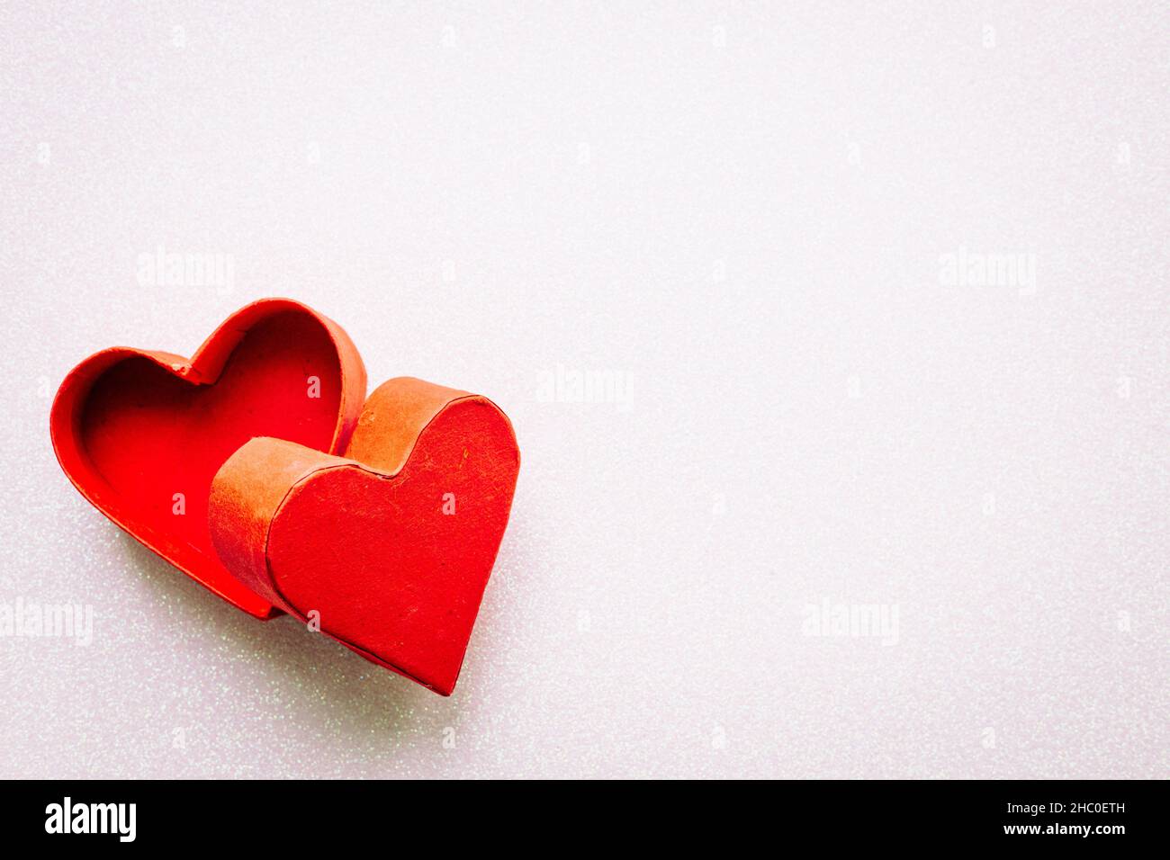 Red heart, half open decorative gift box for a loved one, silvery ...