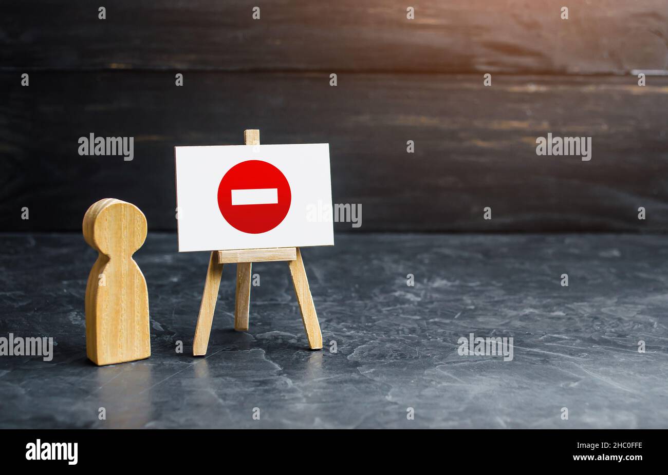People and easel with a prohibition sign. Restrictions on rights, rules ...