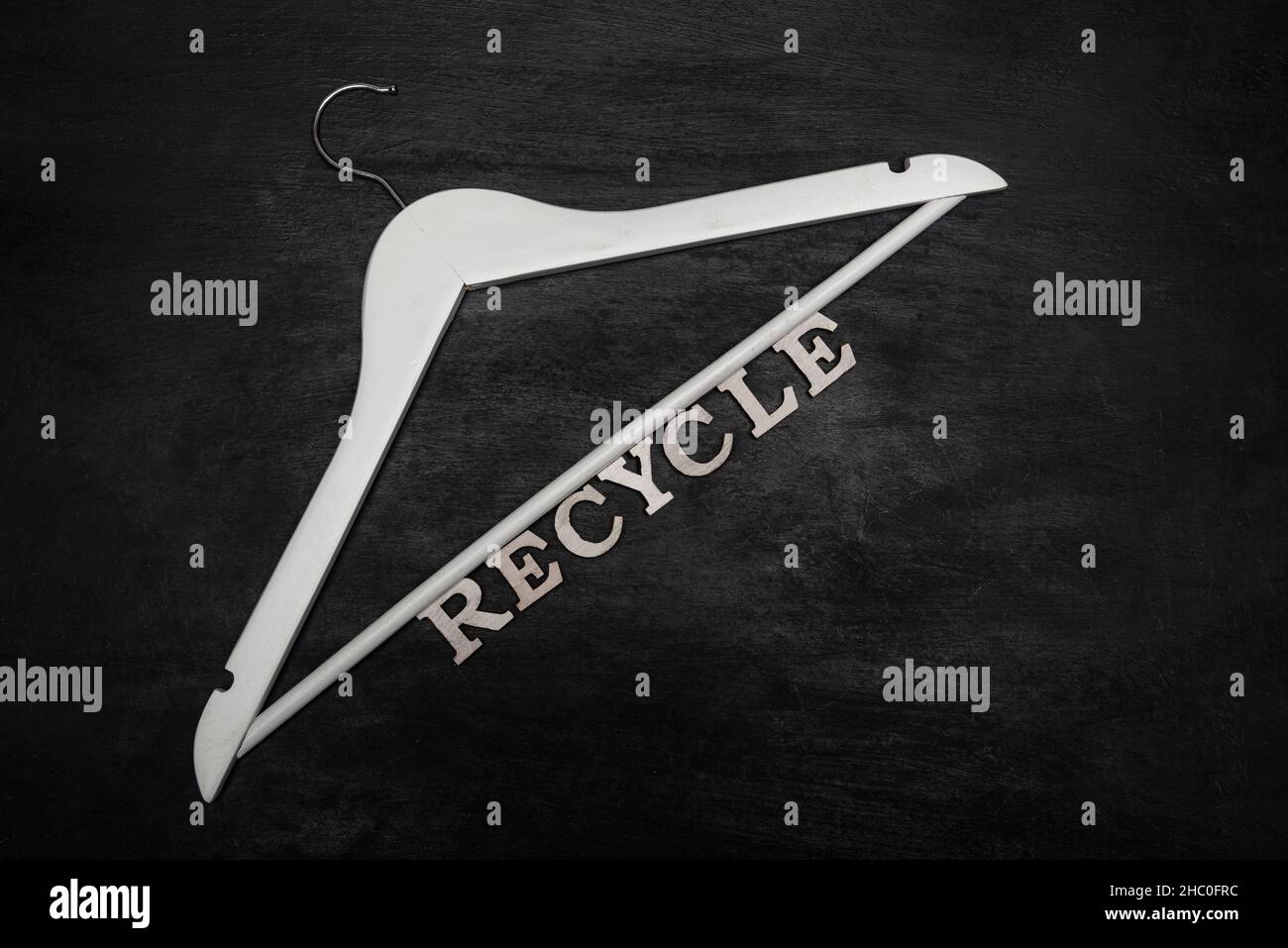 White Hanger and inscription Recycle On Black Background. Recycling ...