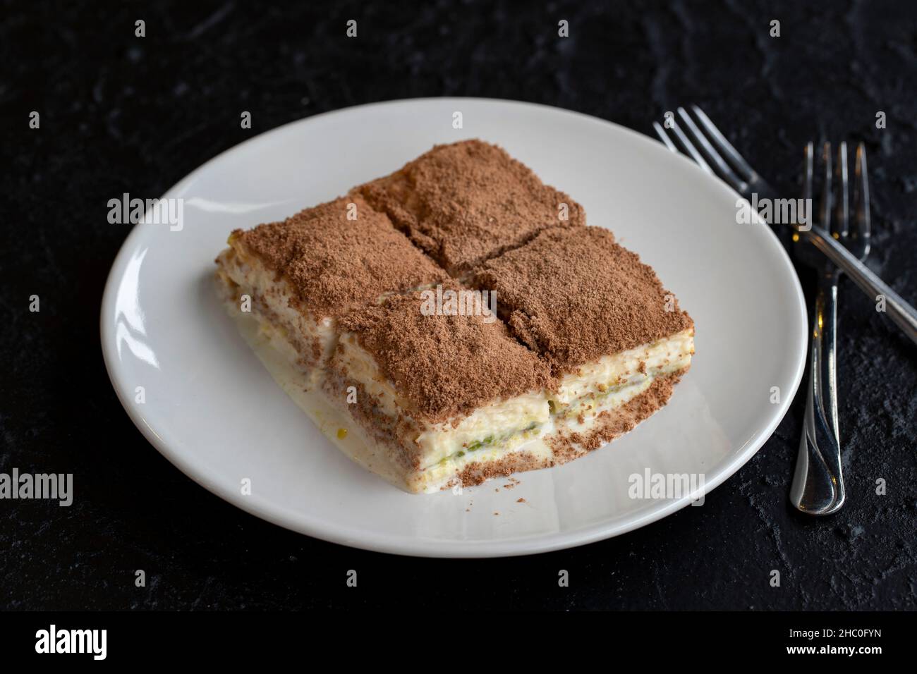 Cold baklava on a dark background. Turkish sweet dessert concept. plate ...