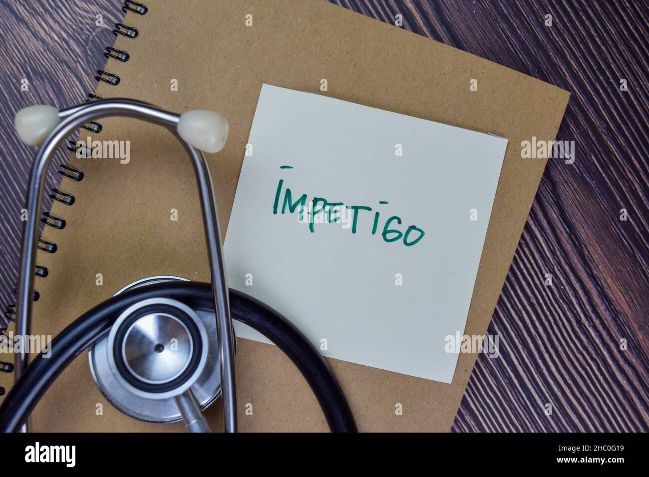 Impetigo write on sticky notes isolated on Wooden Table Stock Photo - Alamy