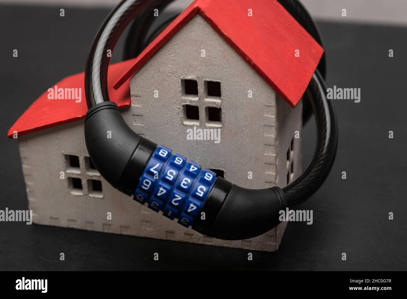 House model and combination lock. Property protection concept. Security ...