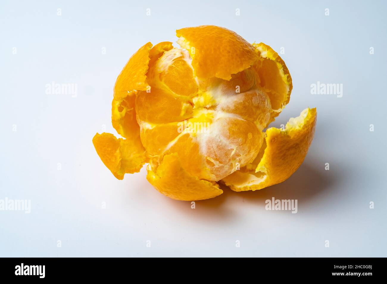 Macro of Peeled Tangerine isolated on white background Stock Photo - Alamy