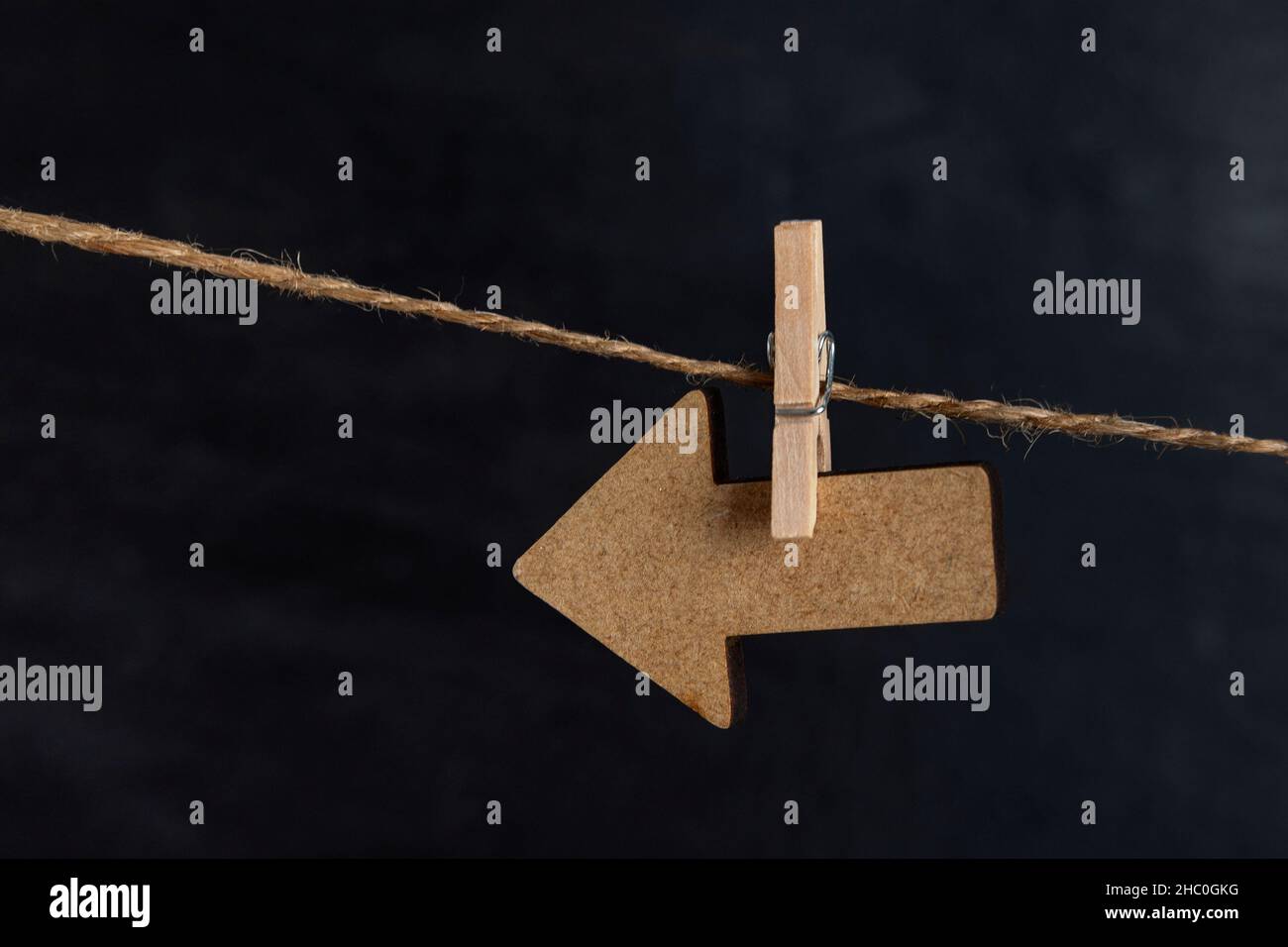 Arrow pointer hanging with clothespin on rope string peg, black ...