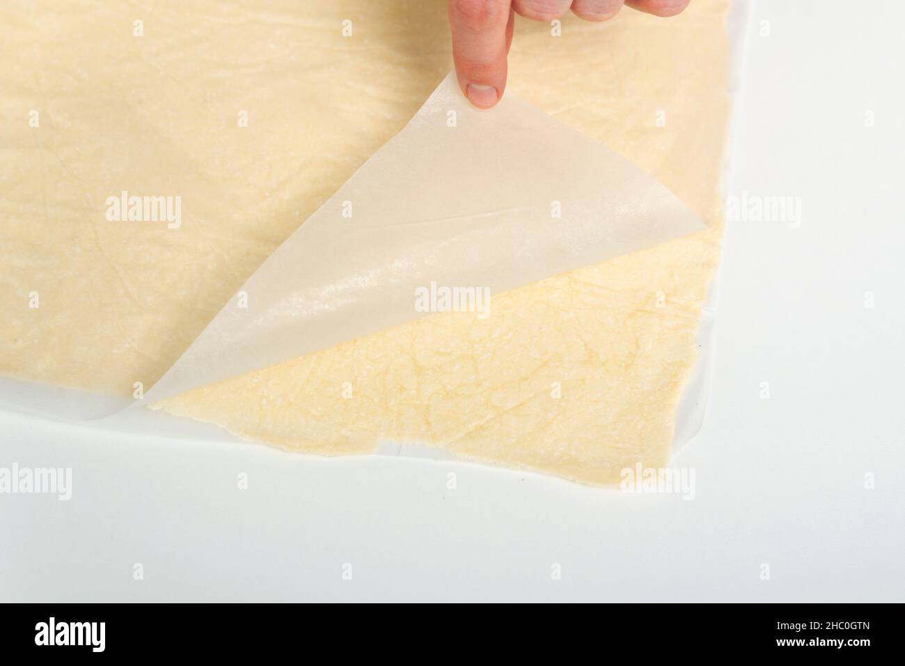 Process of making apple pie, strudel. Thinly rolled dough in parchment ...