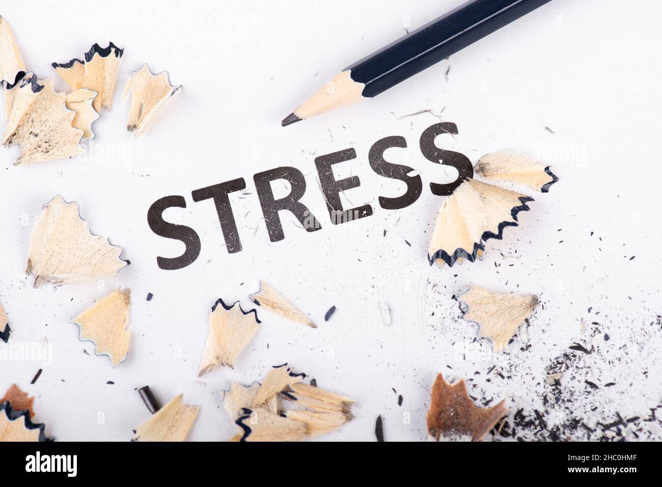 The word stress is standing on a paper, pen with eraser, burnout ...