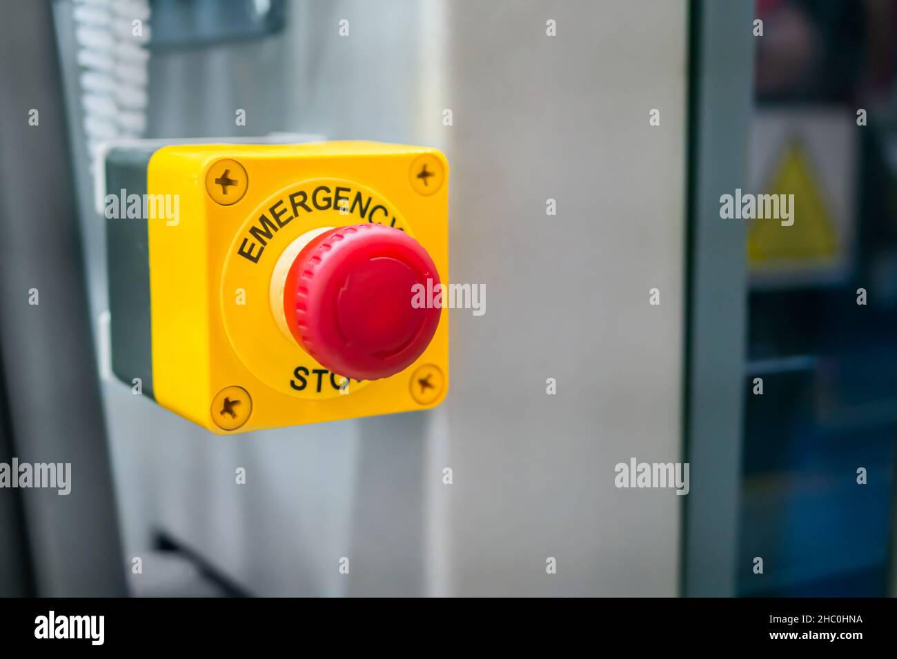 Close up view: machine control panel with red switch button - emergency ...