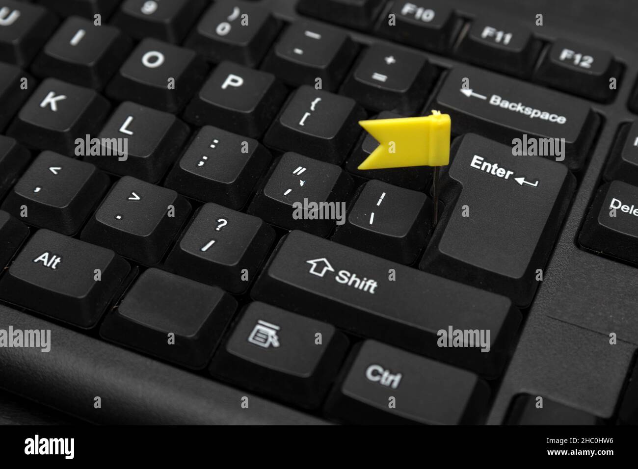 Black computer keyboard and yellow check mark. Important key Enter ...