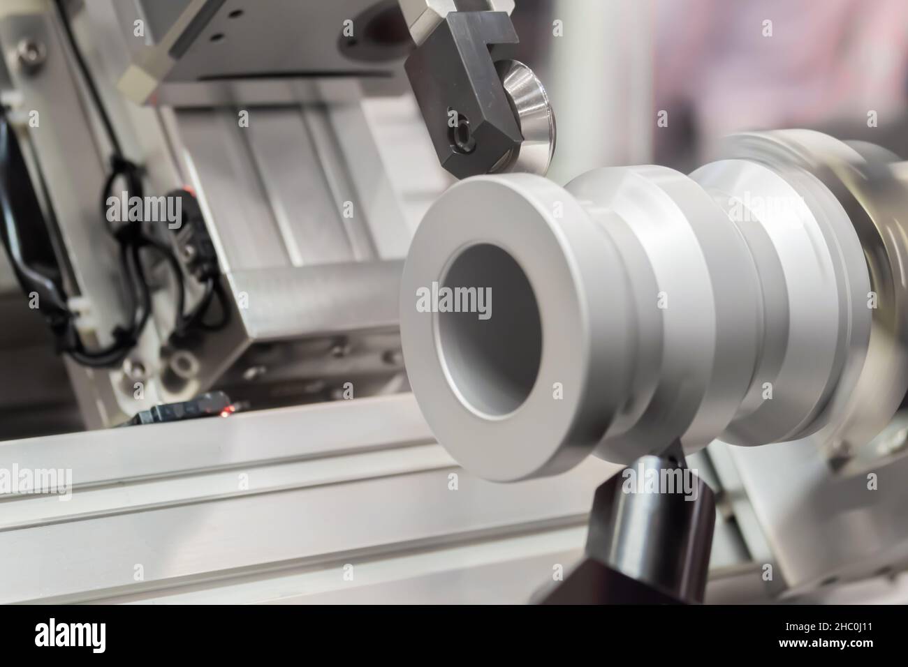 Automated cnc turning milling machine cutting metal workpiece at ...