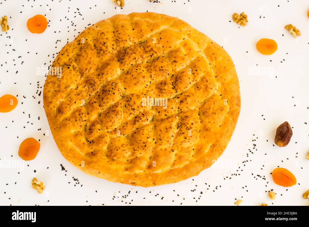 Traditional Turkish,Fresh,Circular Ramadan Bread on white surface with ...