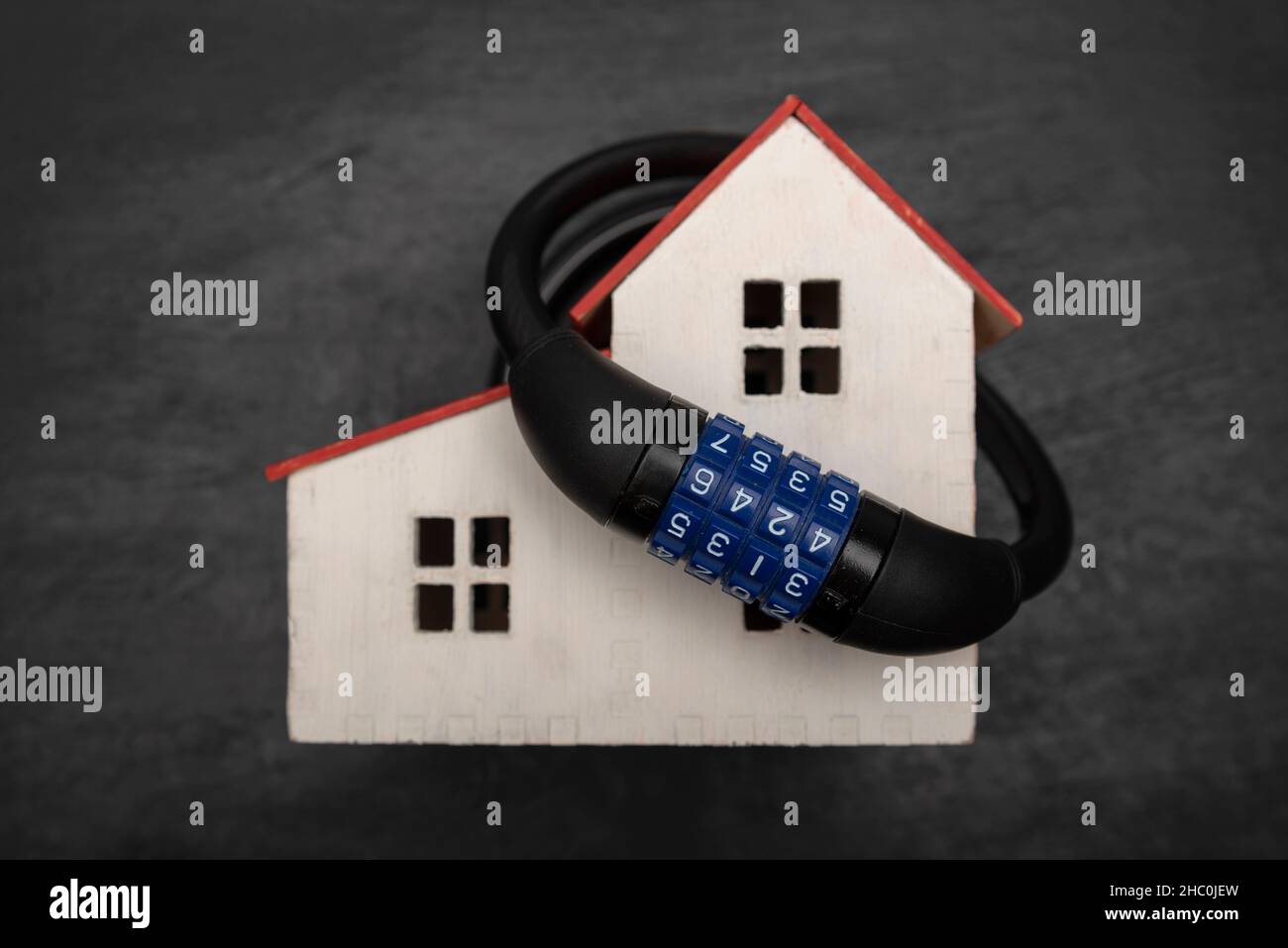 Combination lock on the house model. Property protection concept ...