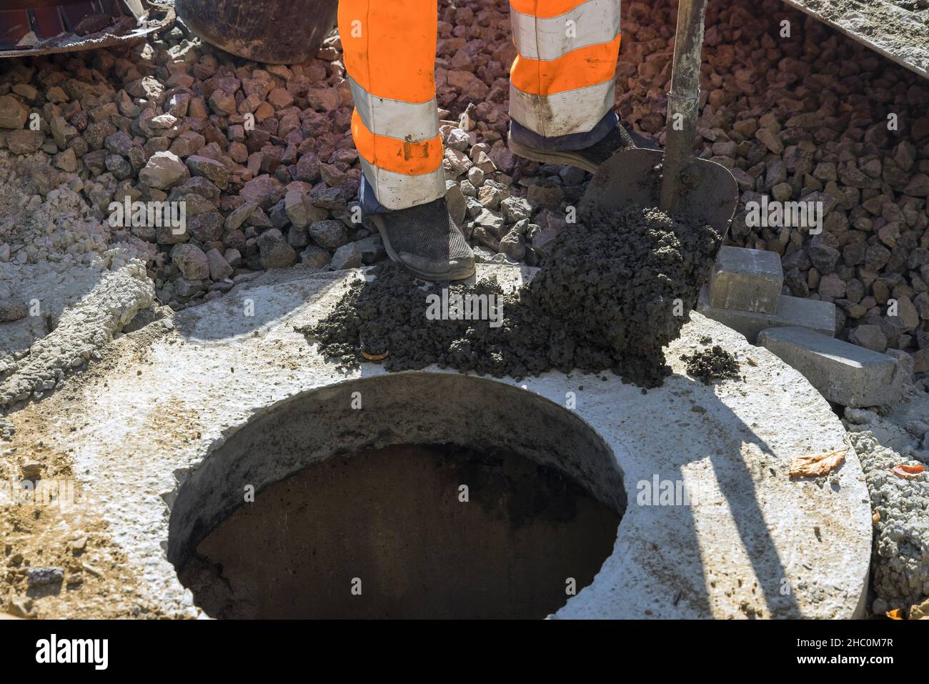 A worker the new road construction work on preparation for installation ...