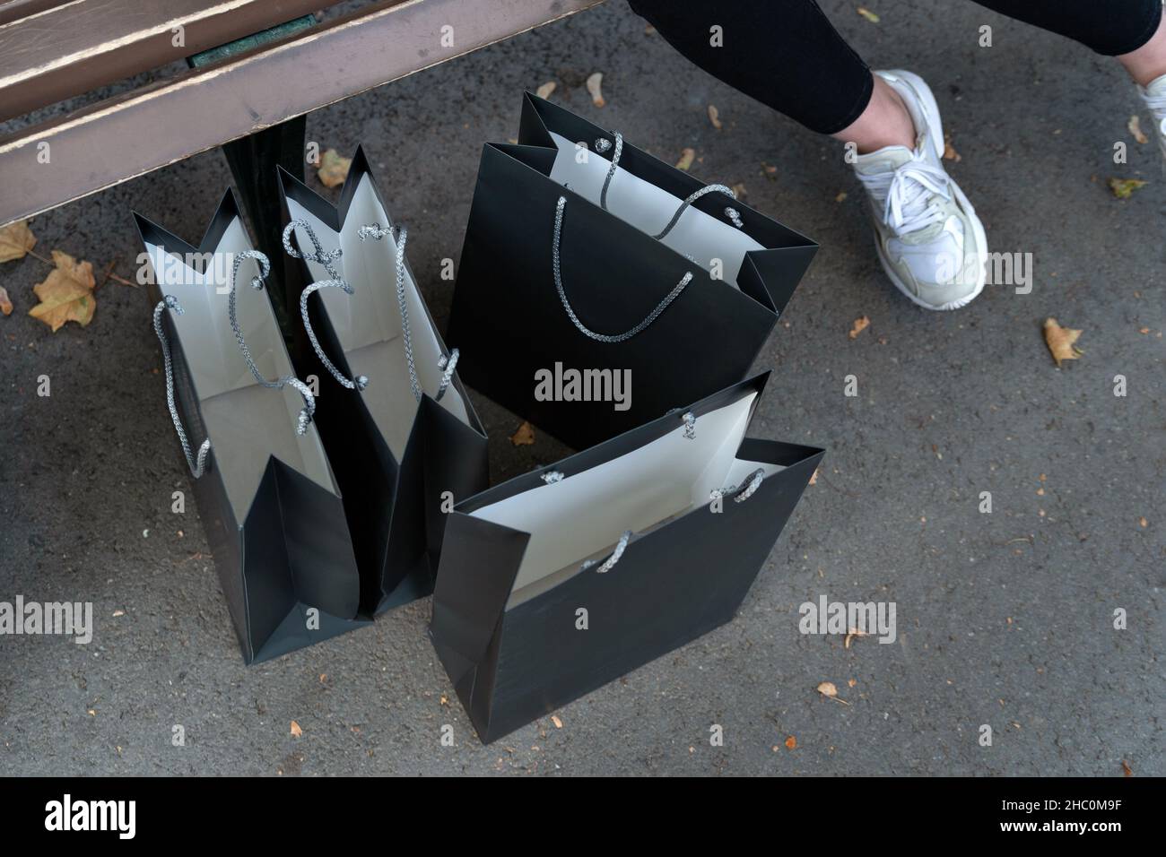 Top view of paper shopping bags. Empty shopping bags. Woman after ...