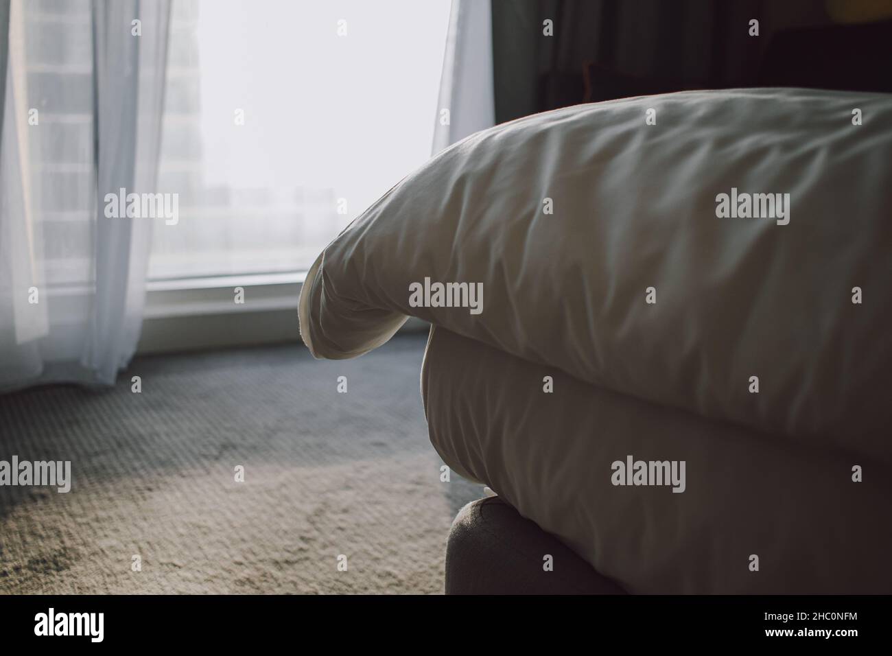 Room interior with bed closeup and white bed fabric cloth blanket and ...