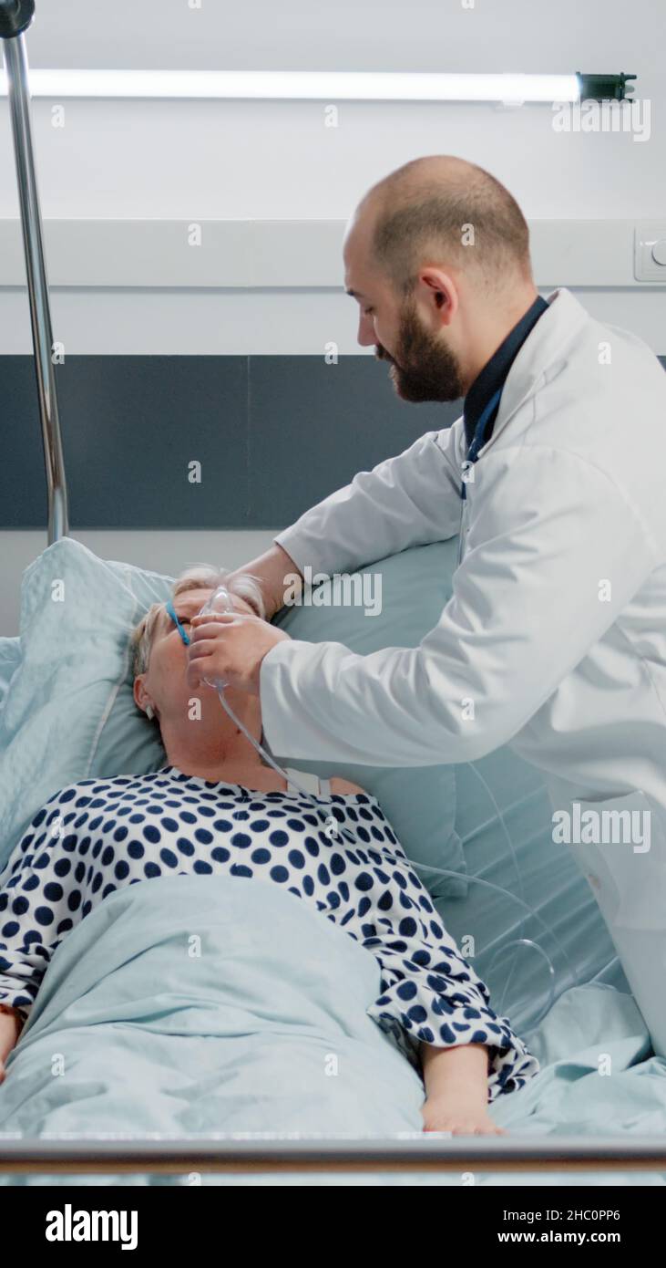 Medical team rushing to help patient with respiratory problem in ...