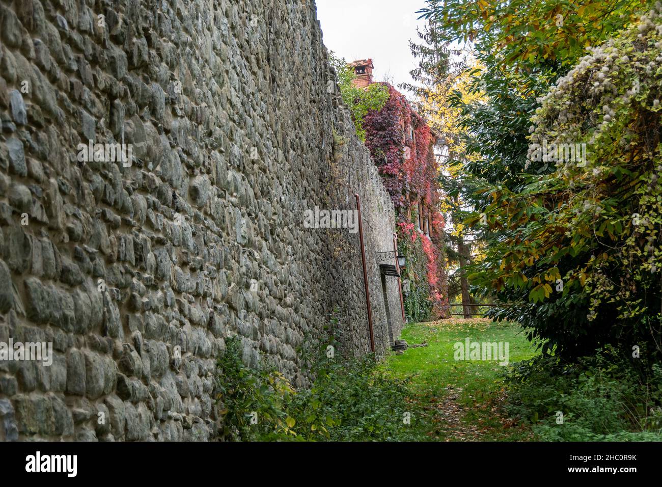 The external walls of the Romena Castle surrounded by the warm colors ...