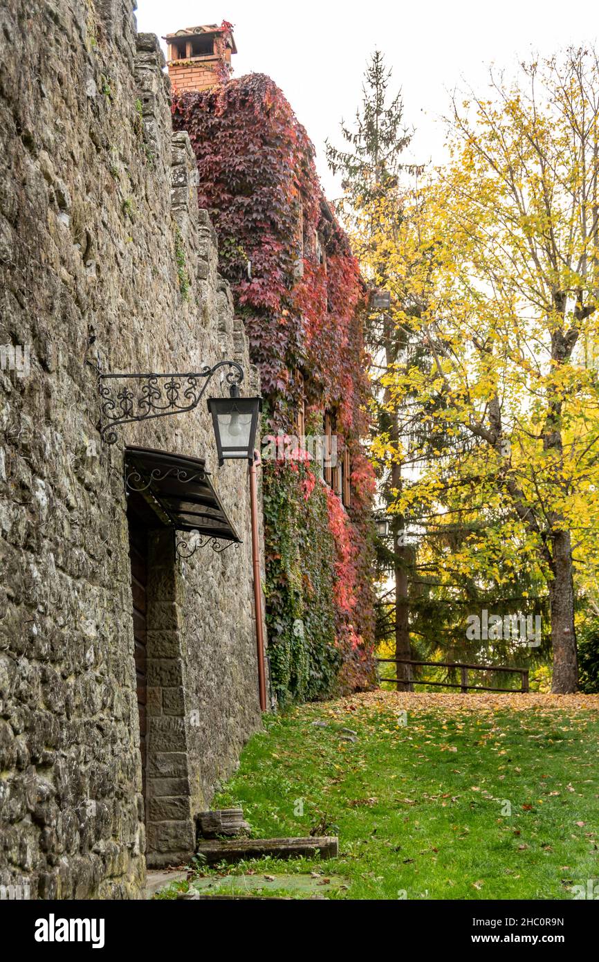 The external walls of the Romena Castle surrounded by the warm colors ...