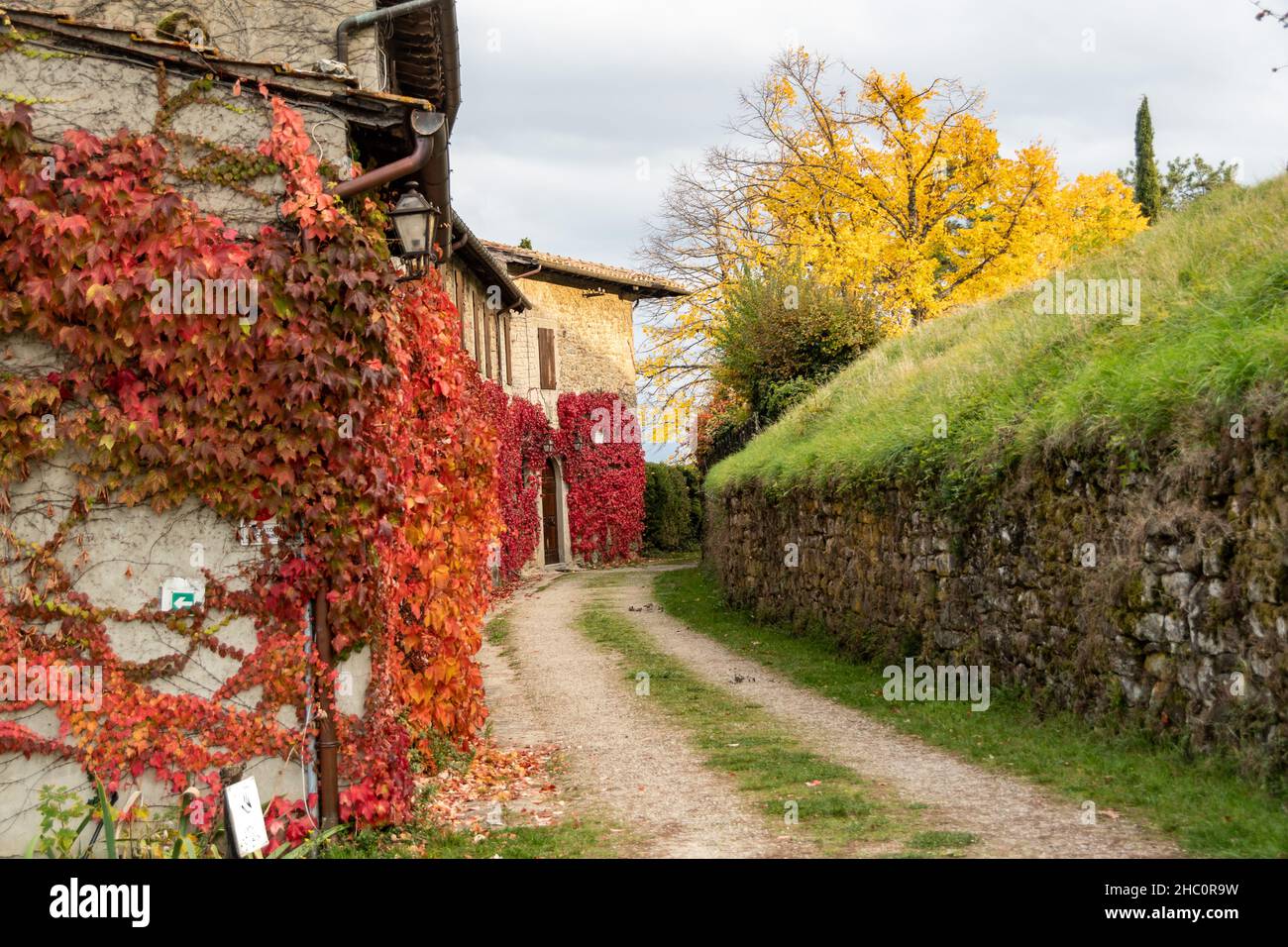 The external walls of the Romena Castle surrounded by the warm colors ...