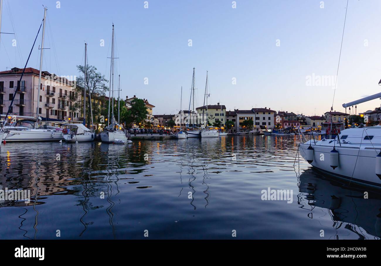 Grado, Italy - July 7, 2021: A bay with different boats in the middle ...