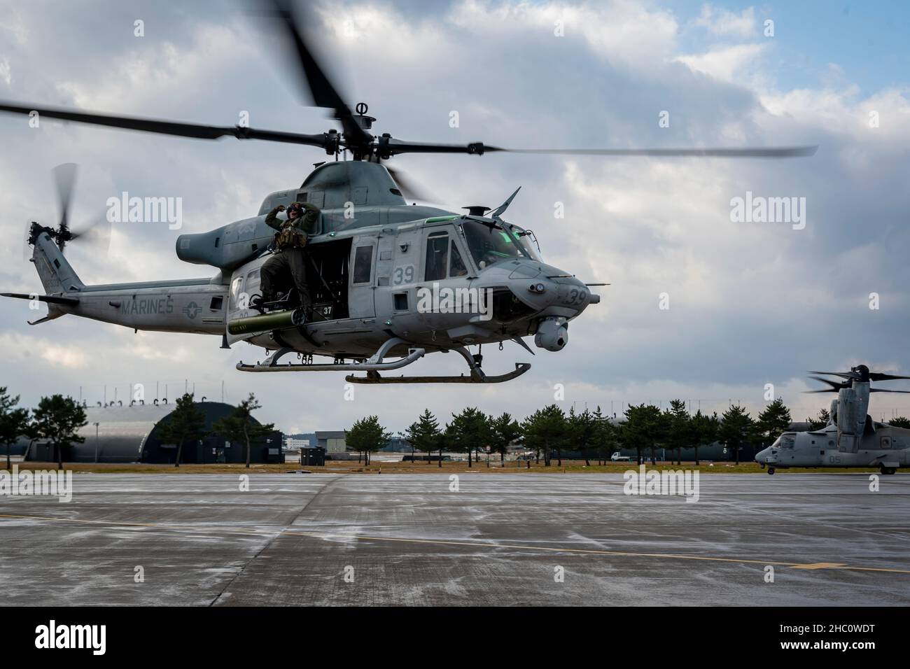 A U.S. Marine UH-1Y Venom flies to the hot cargo pad to perform a ...