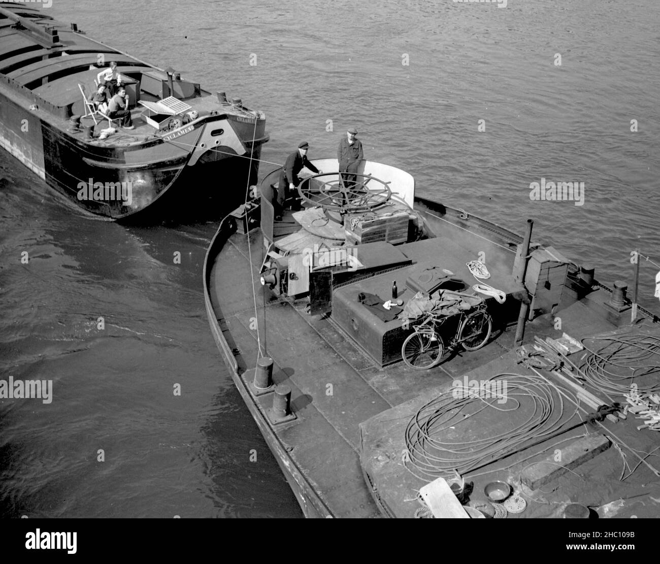 Paris Seine river barges with people looking down from a bridge, 1945 ...