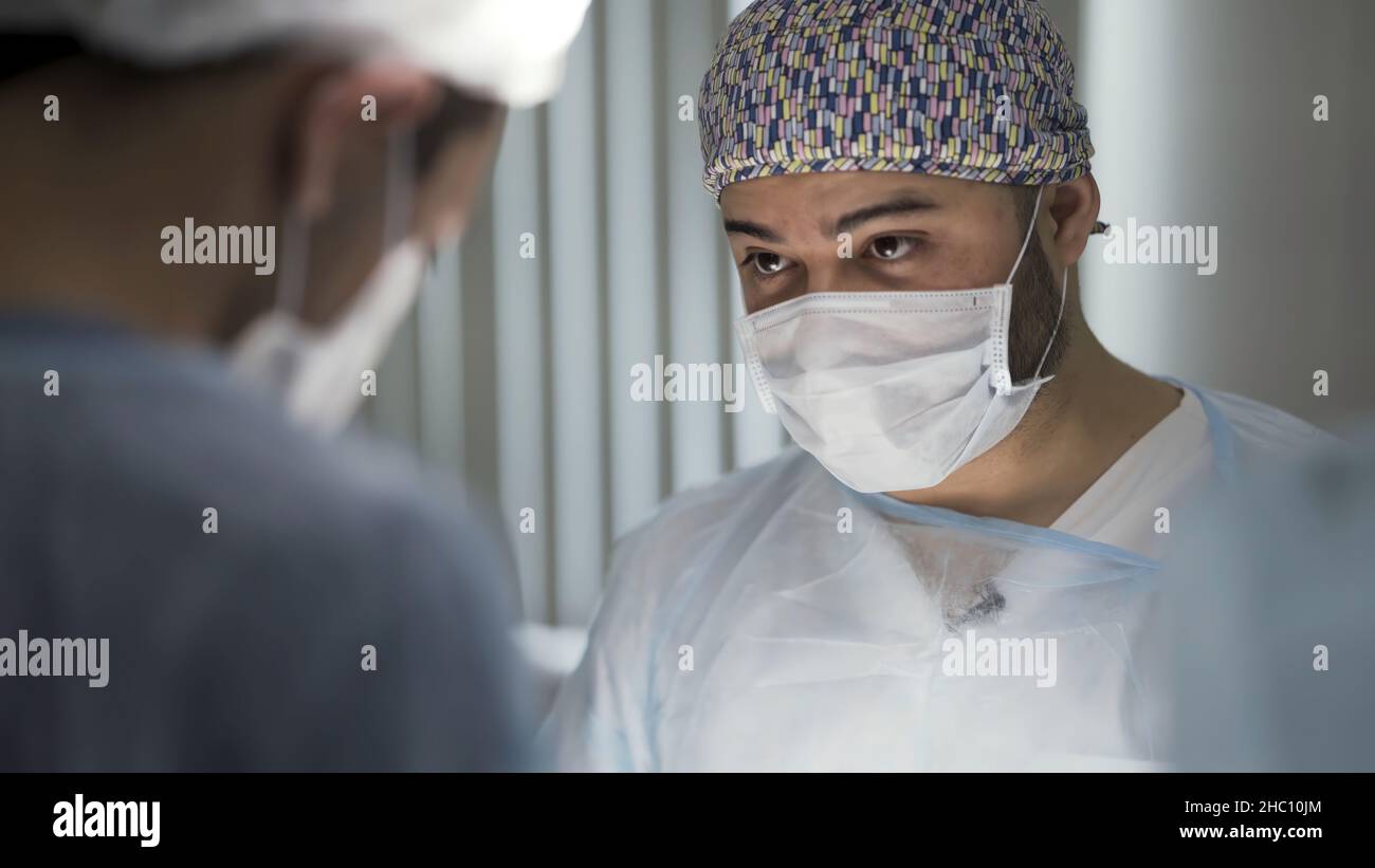 The medical surgeons team in the hospital performing surgical operation ...
