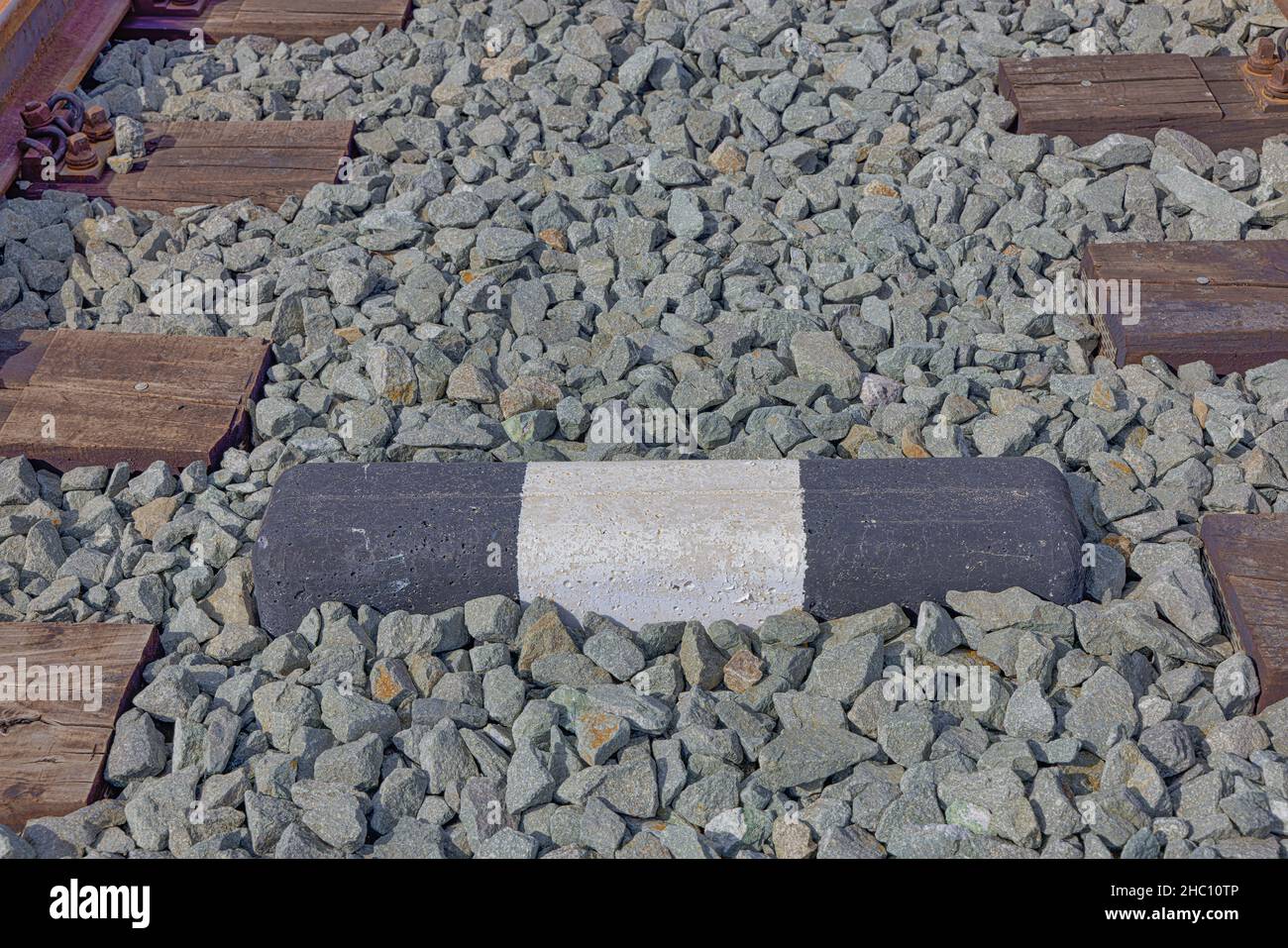 Train mark on railroad track close up Stock Photo - Alamy