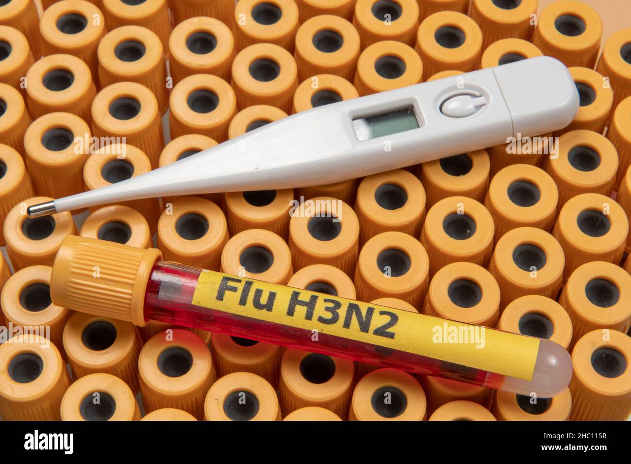 blood collection tubes labeled "Flu H3N2" symbolizing the flu epidemic ...