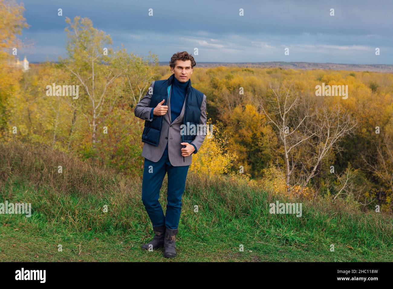 Tall handsome man outdoor in autumn forest on the hill Stock Photo - Alamy