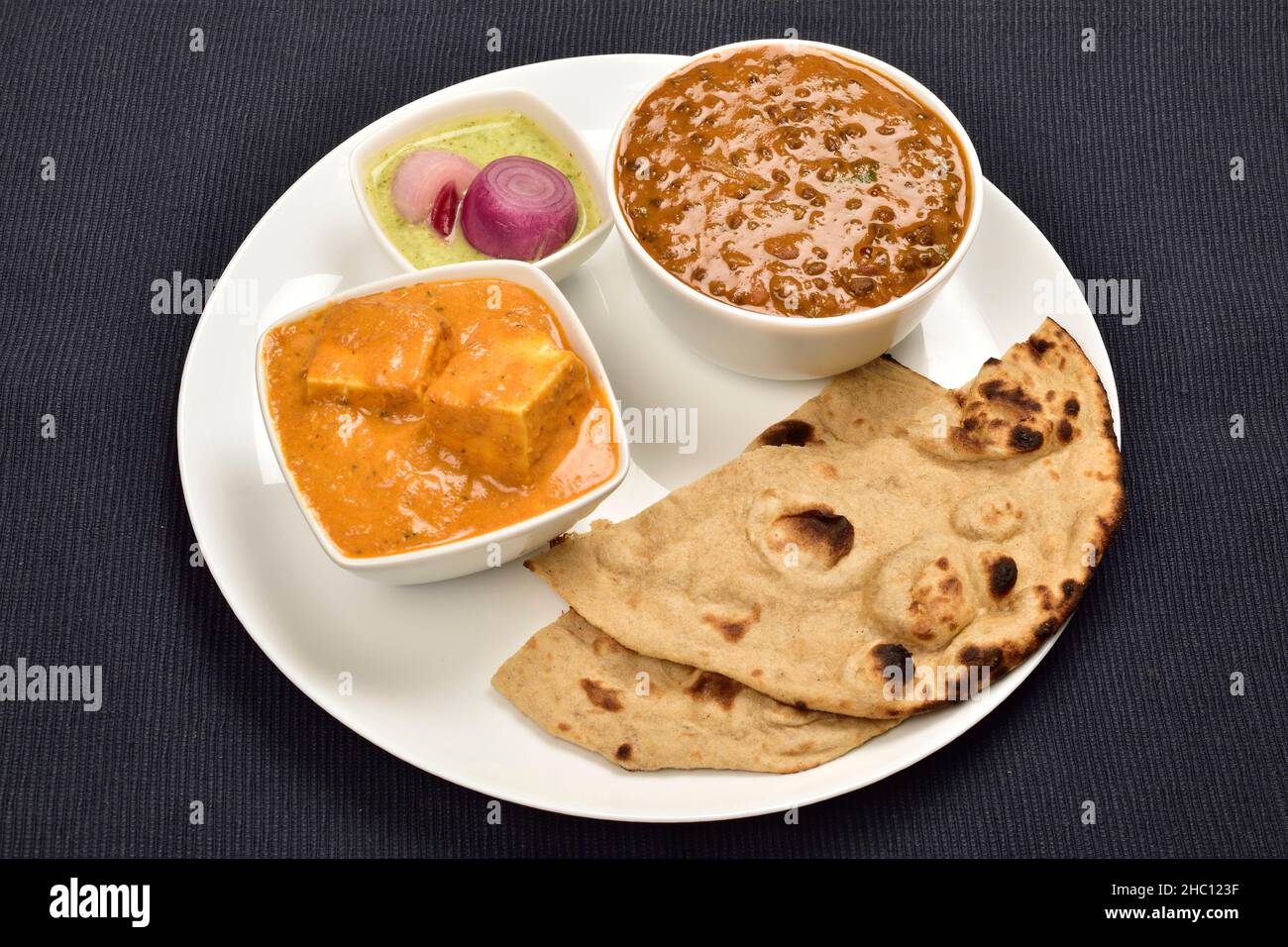 Shahi Paneer and Dal Makhani Served with Tandoori Chapati in Plate ...