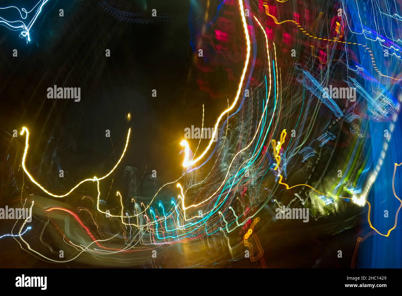 Light trails of urban traffic. Light painting. Neon glow. Symmetry and ...