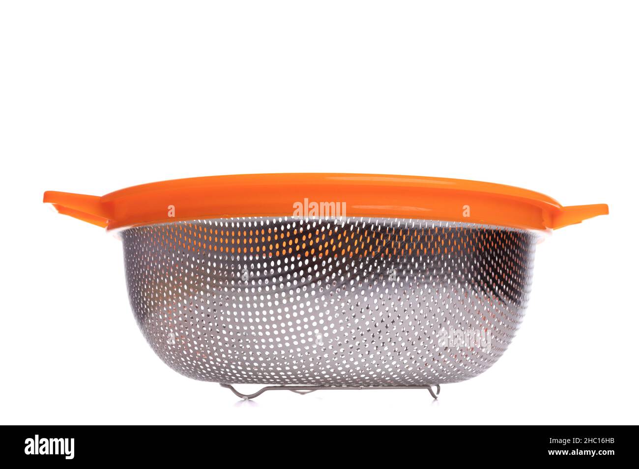 Empty metal colander on legs with orange rim on white background Stock ...