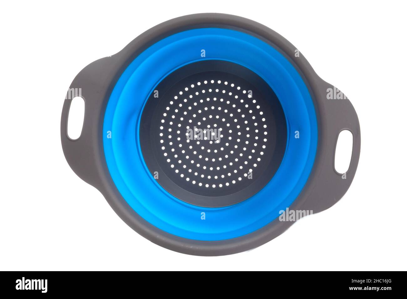 plastic gray colander with blue insert on white background, top view ...