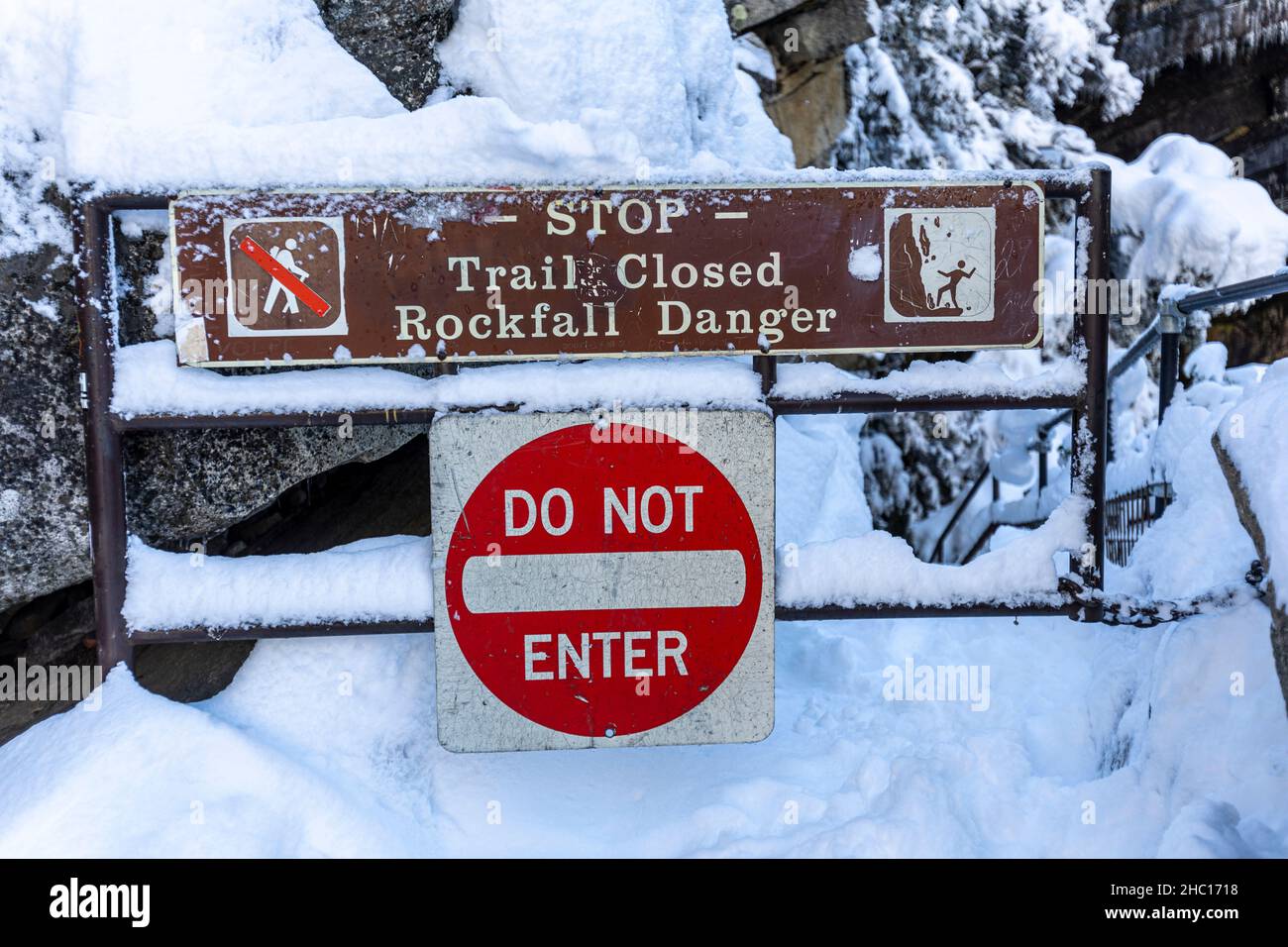Closed sign and gate near Clark Point on winter trail after snow storm ...
