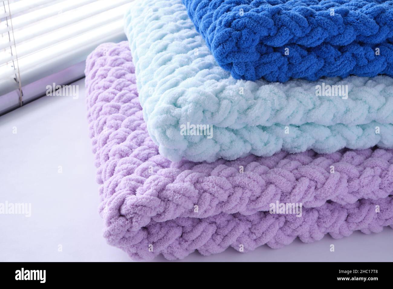 Warm, delicate and plush handmade baby blankets in three colors of blue, lilac and mint on ...