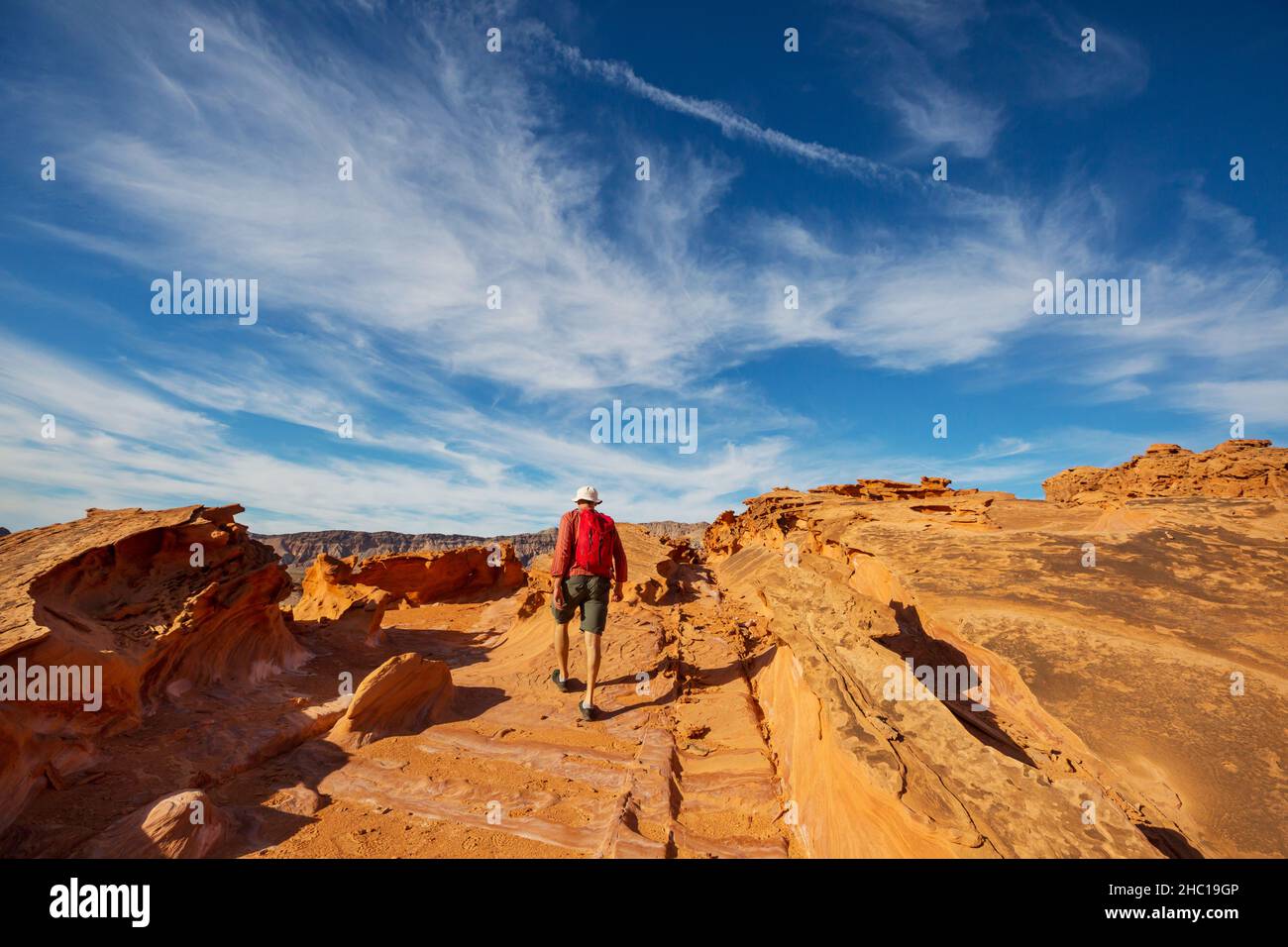 Hiker inside a stone arch in the Nevada desert near Las Vegas, Nevada ...