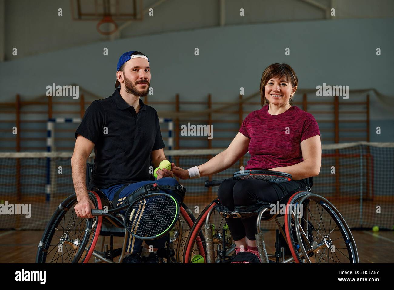pair of disabled tennis players hugging each other and smiling Stock ...