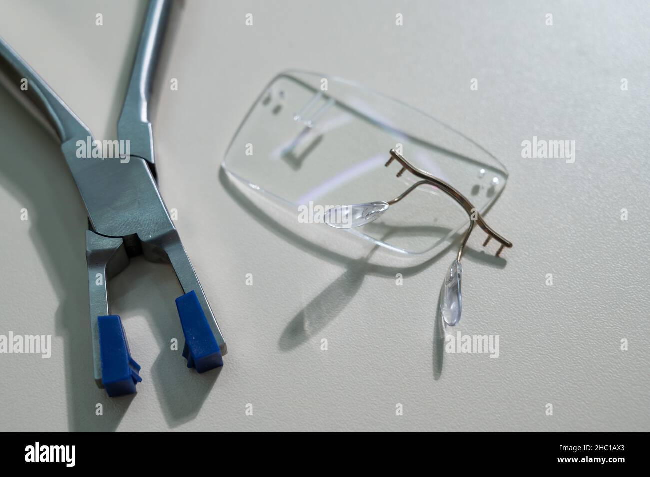 Disassembled glasses and instruments by an ophthalmologist Stock Photo ...