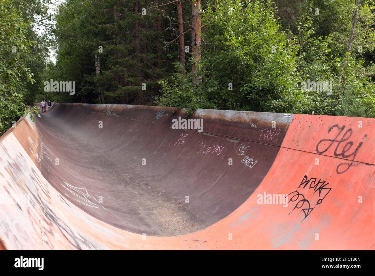 UMEA, SWEDEN ON JULY 17, 2021. Old log flume surrounded by trees on ...