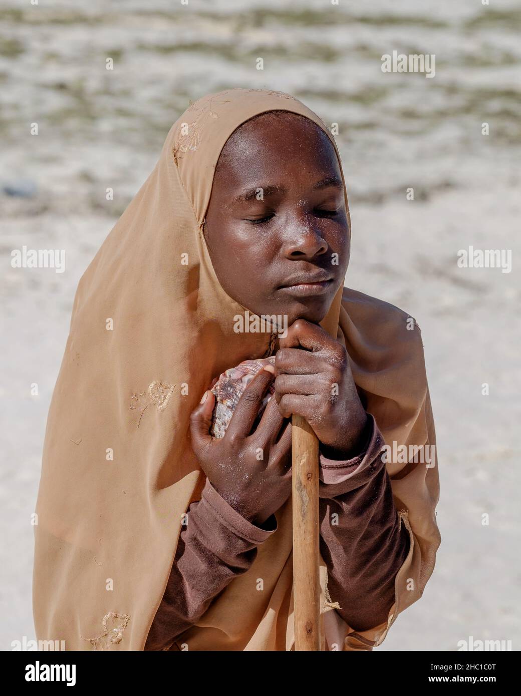 All the locals in Zanzibar go out at sunset to enjoy the beach Stock ...