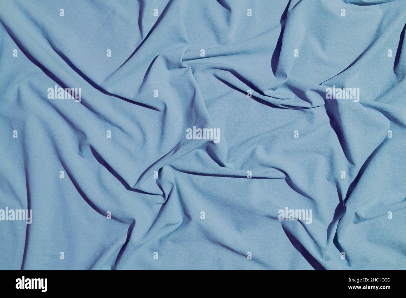 Fabric cotton background. Folds, texture and draperies on the surface ...