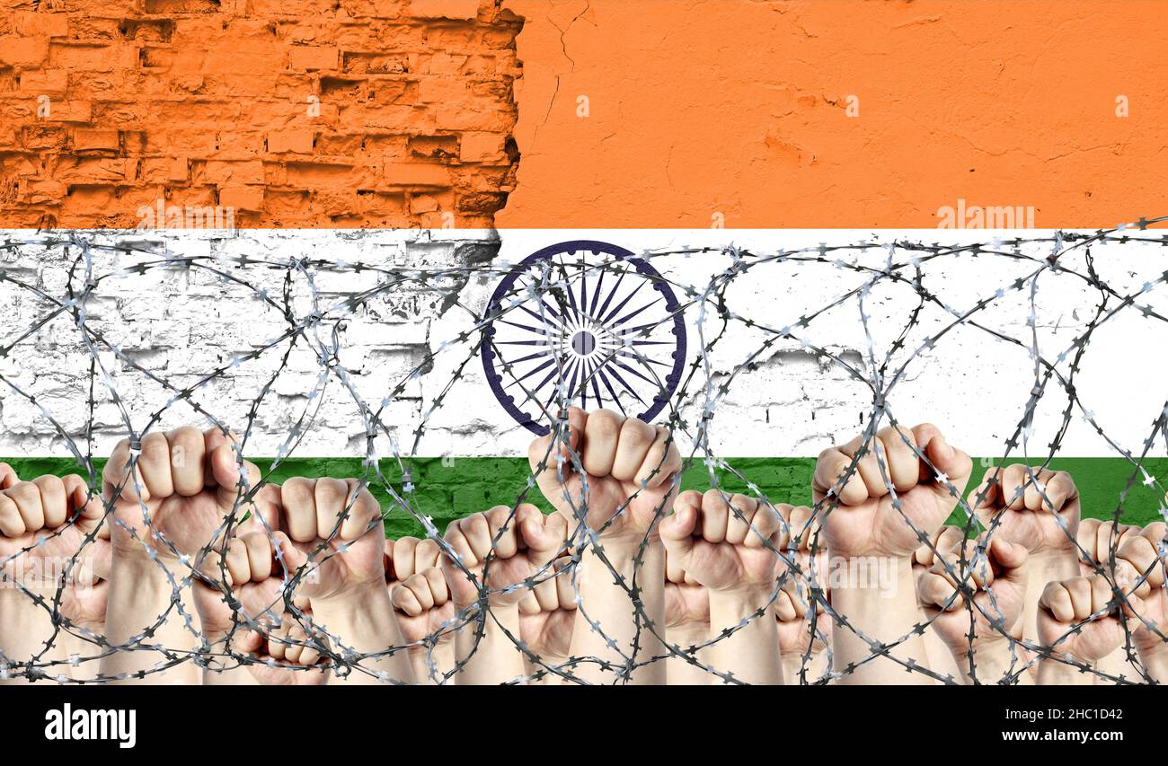 Barbed wire against the background of the inflicted flag of India and ...