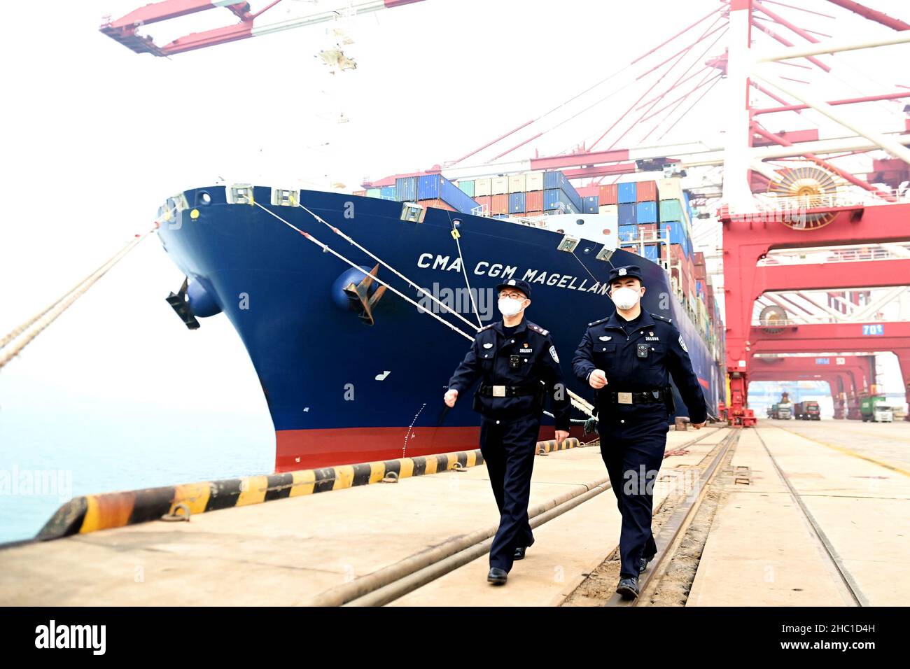 QINGDAO, CHINA - DECEMBER 23, 2021 - Police officers patrol beside ...