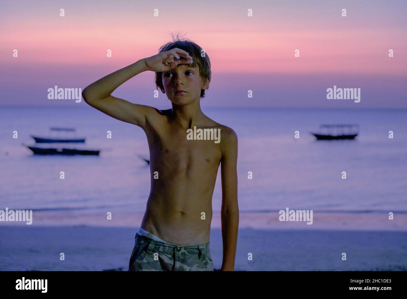 Boy enjoying a perfect sunset Stock Photo - Alamy