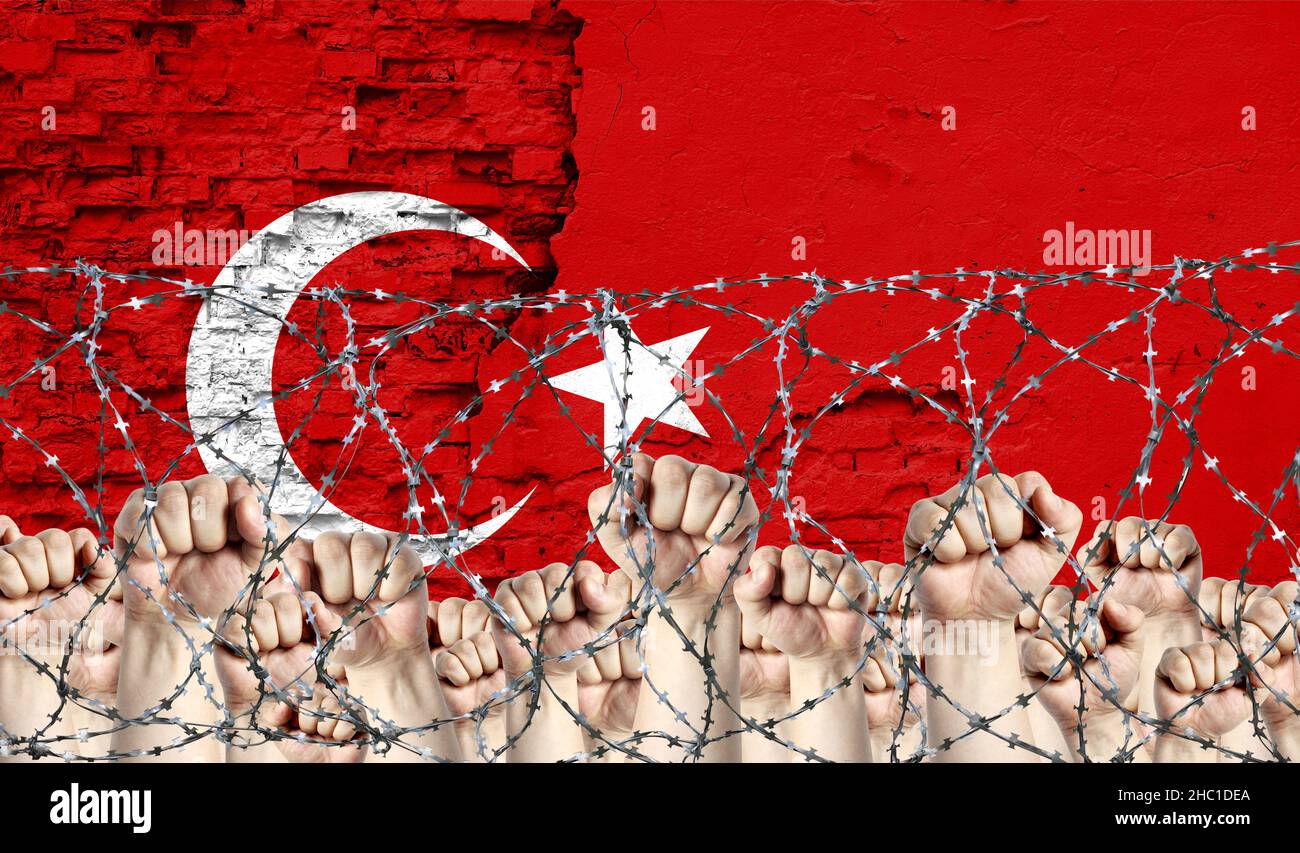 Barbed wire against the background of the inflicted flag of Turkey and ...